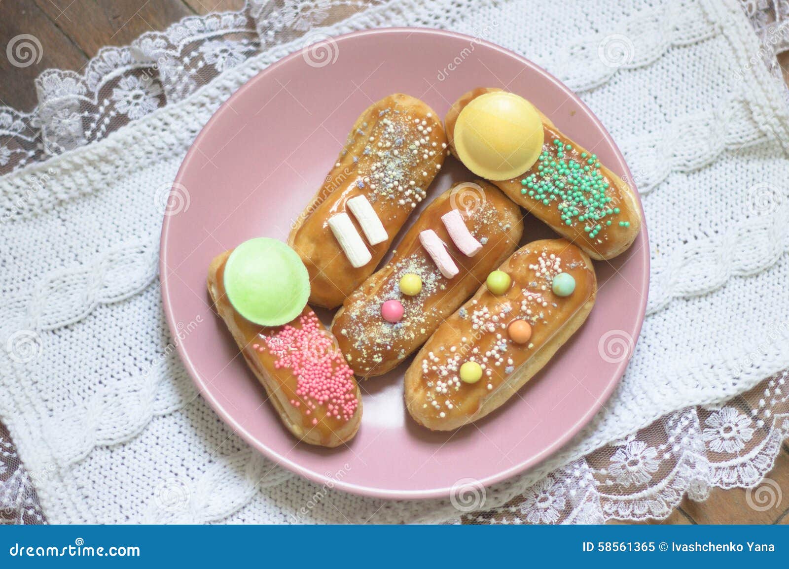 Nicely Decorated Eclair on a Pink Plate. Stock Image - Image of ...