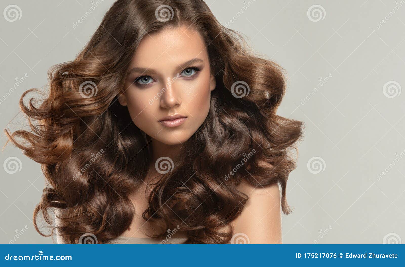 Nicely Looking Young Model is Demonstrating Beautiful, Curly Hairstyle ... Nicely Looking Young Model is Demonstrating Beautiful, Curly Hairstyle ...