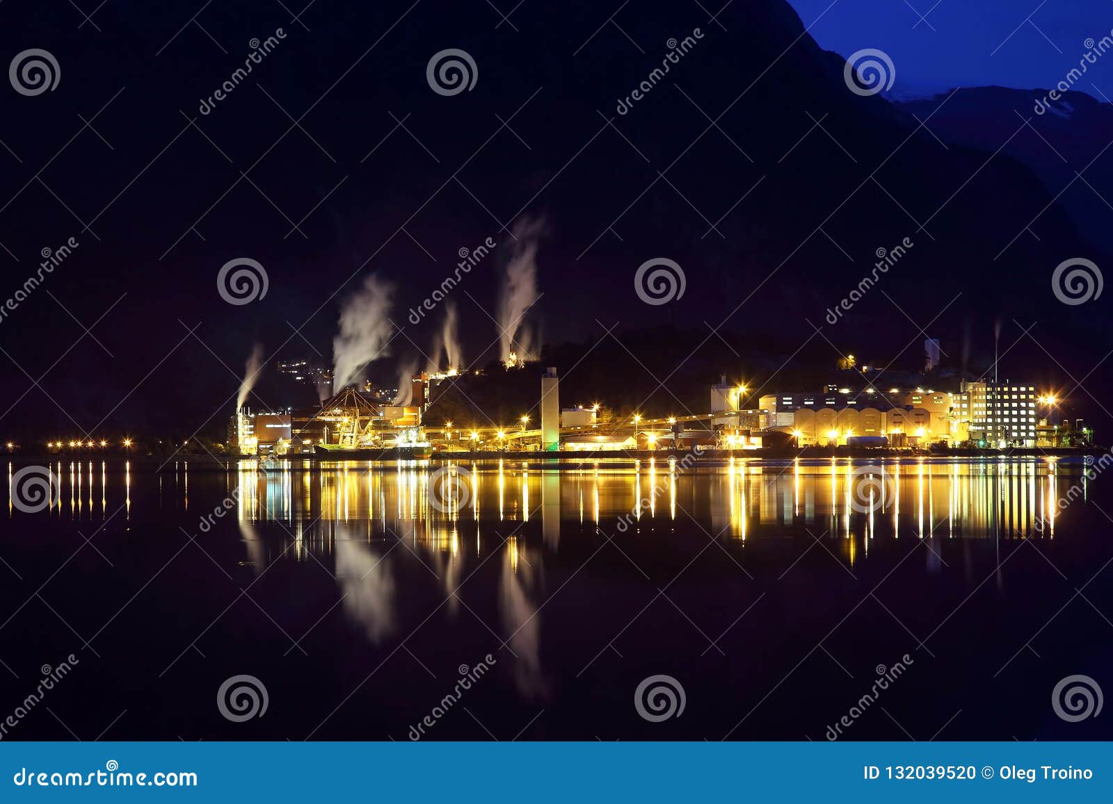 Night City Odda in the Reflection of Water. Norway Stock Photo - Image ...