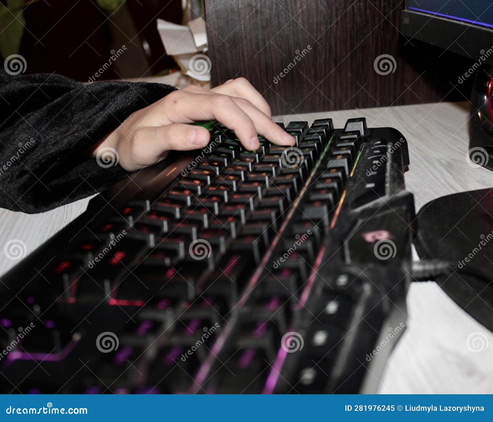 At Night, a Hand on the Black Keys of a Computer Keyboard Stock Image ...