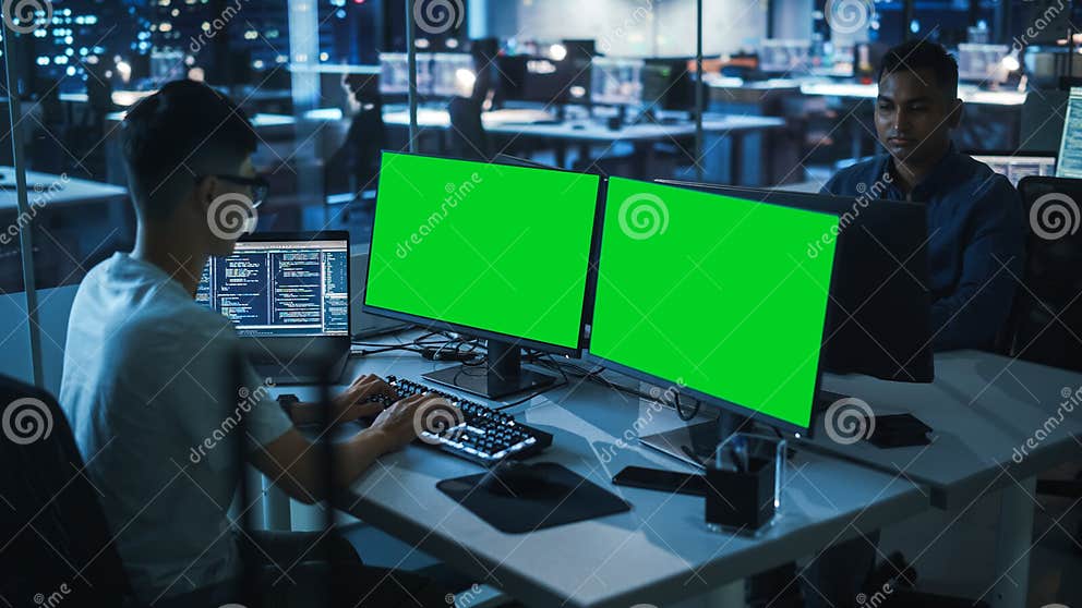 Night Office: Young Japanese Man in Working on Green Screen Chroma Key ...