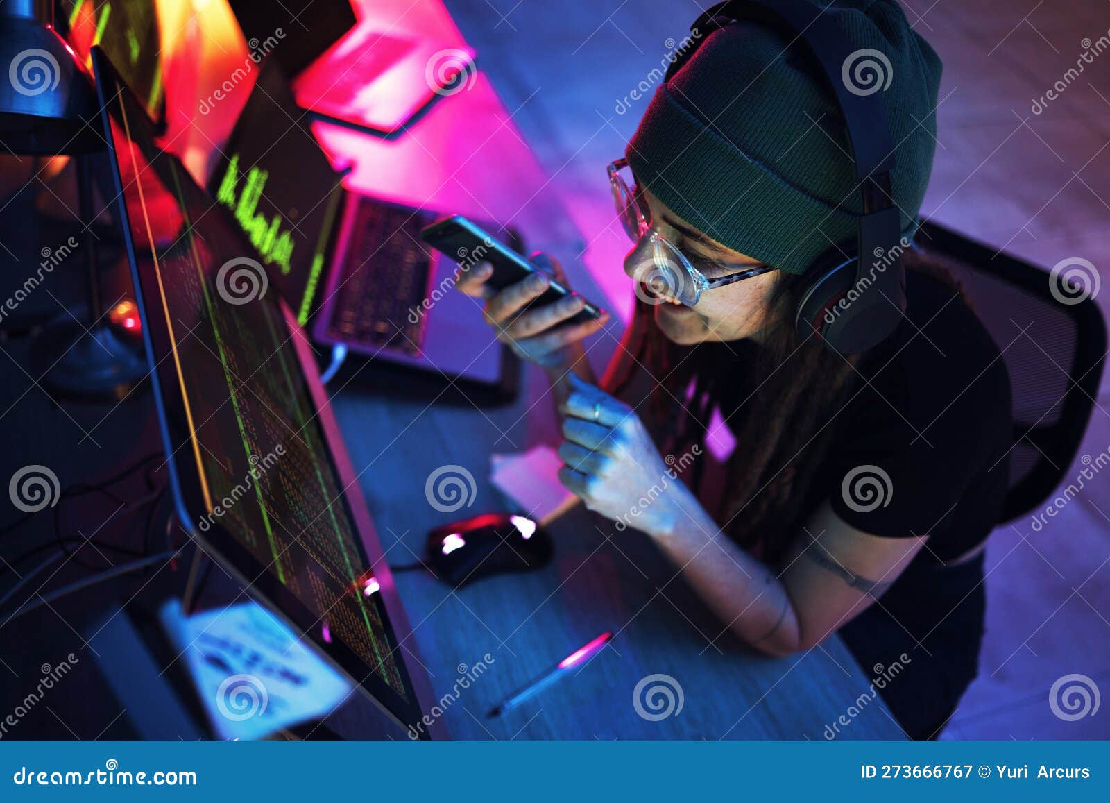 Girl Hacker In A Hood Typing Program Code While Committing A Cybercrime