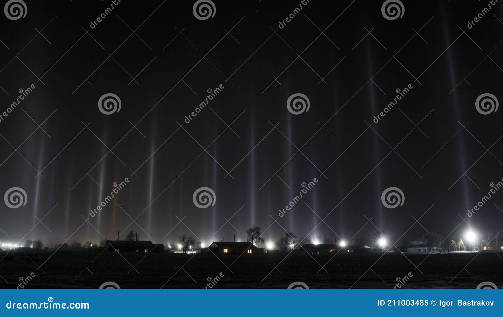 Night Photo of the Village, Light Rays from Searchlights in the Cold ...