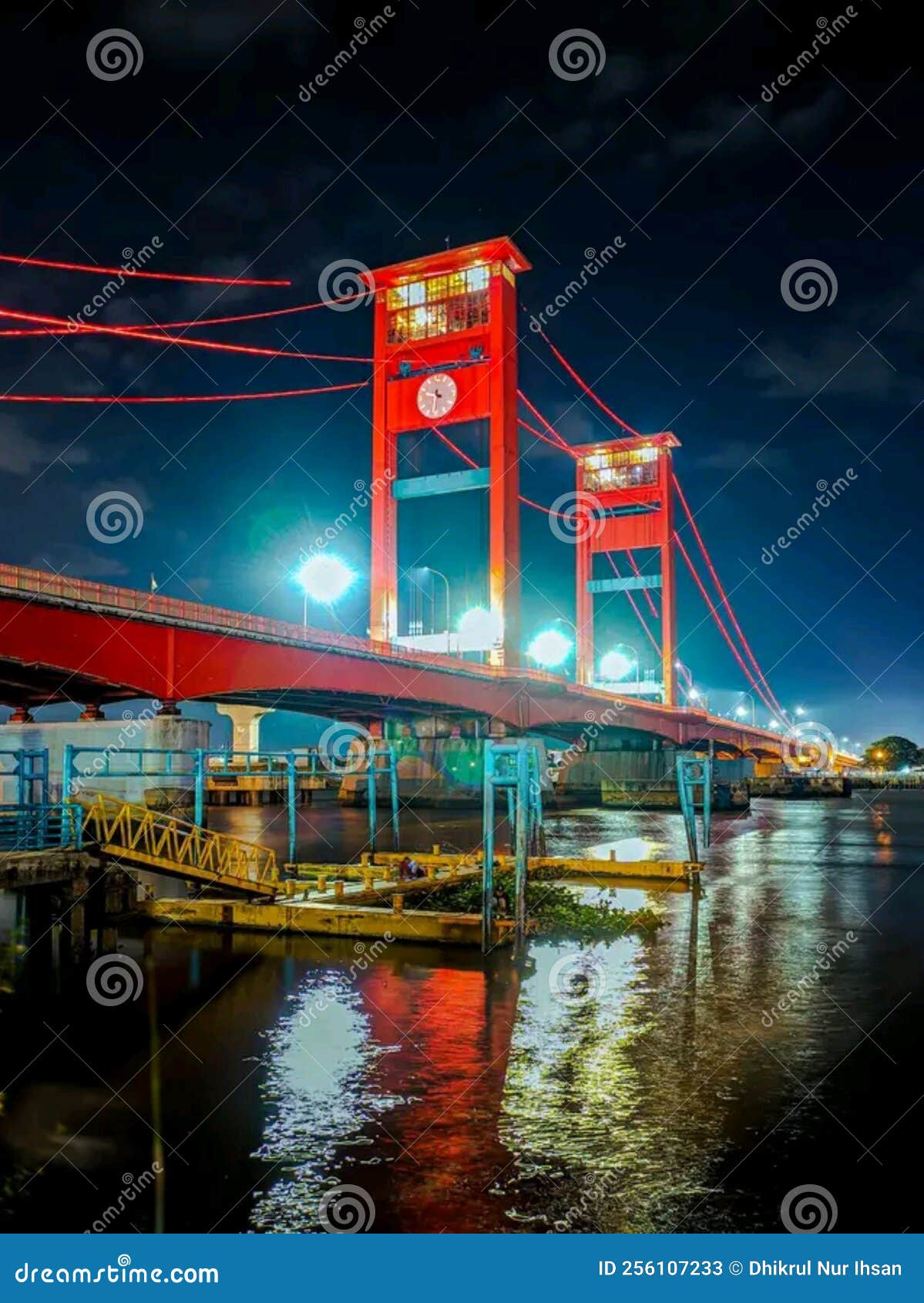 Reflection Of The Bridge Railing And Trees In The Street Gutter ...