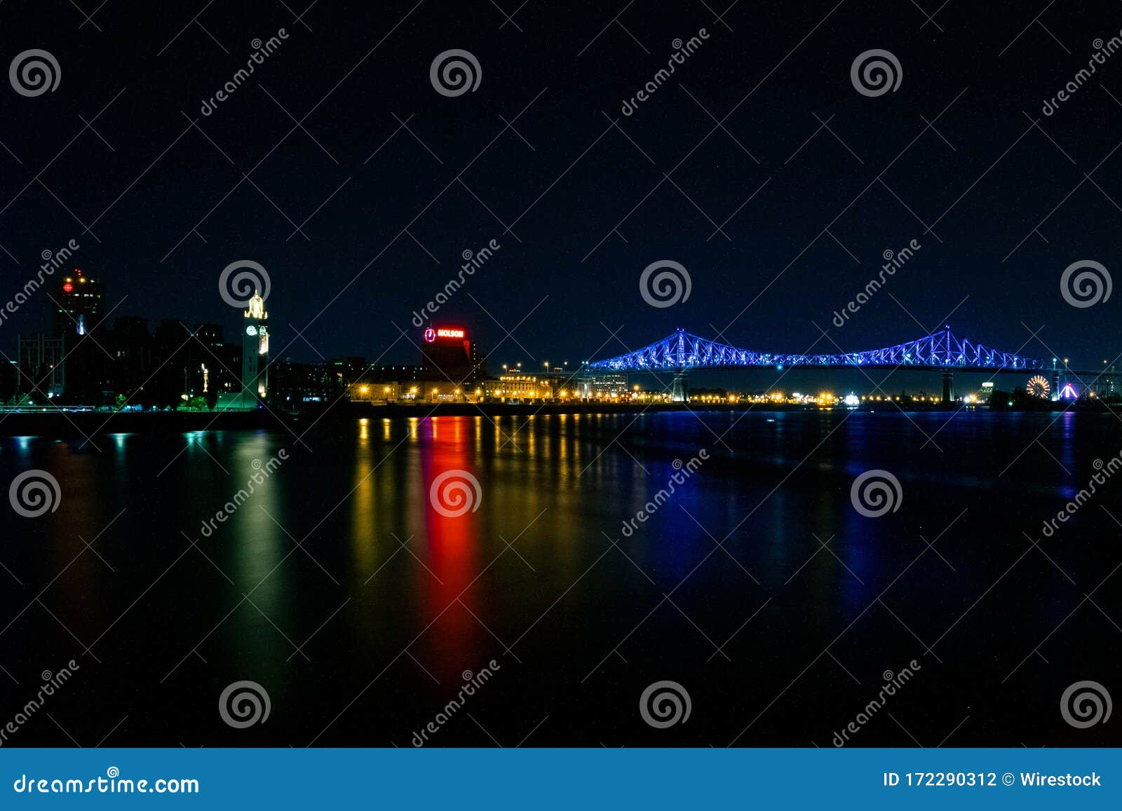 Night Scene of a City Skyline with Light Reflection on the Lake ...