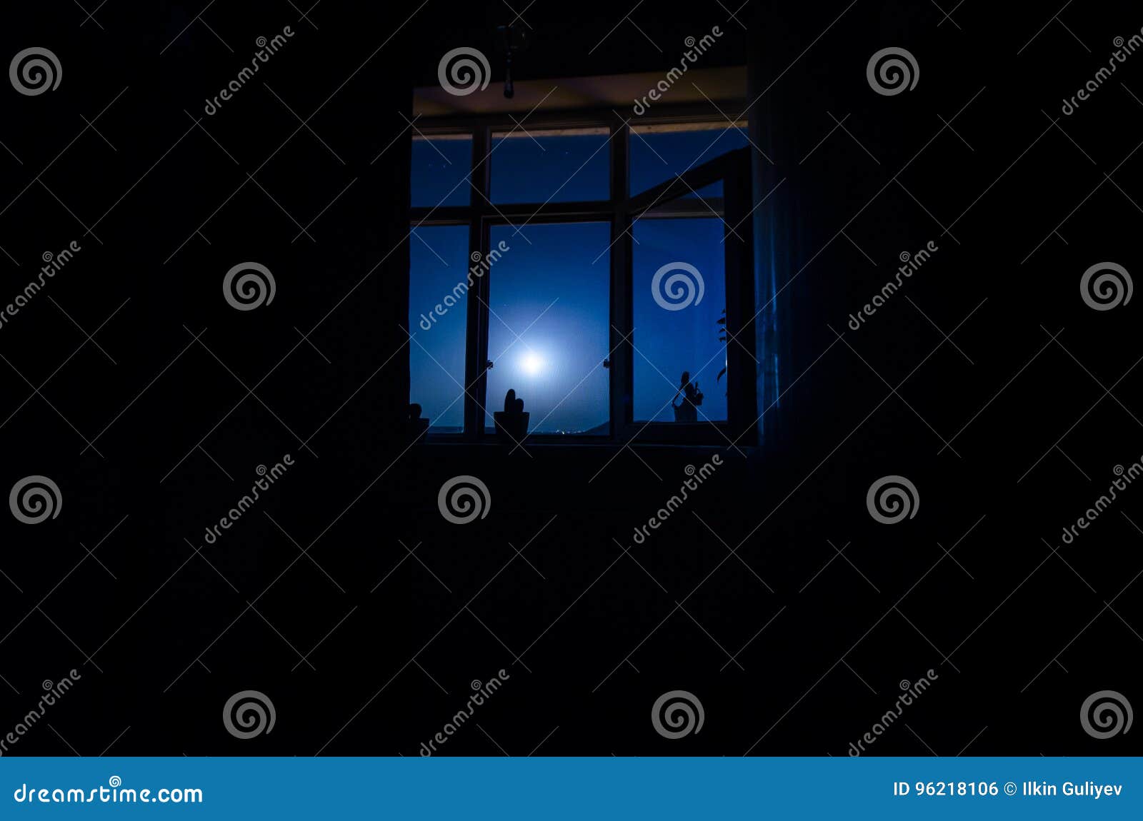 Night Scene of Moon Seen through the Window from Dark Room. Stock Photo ...