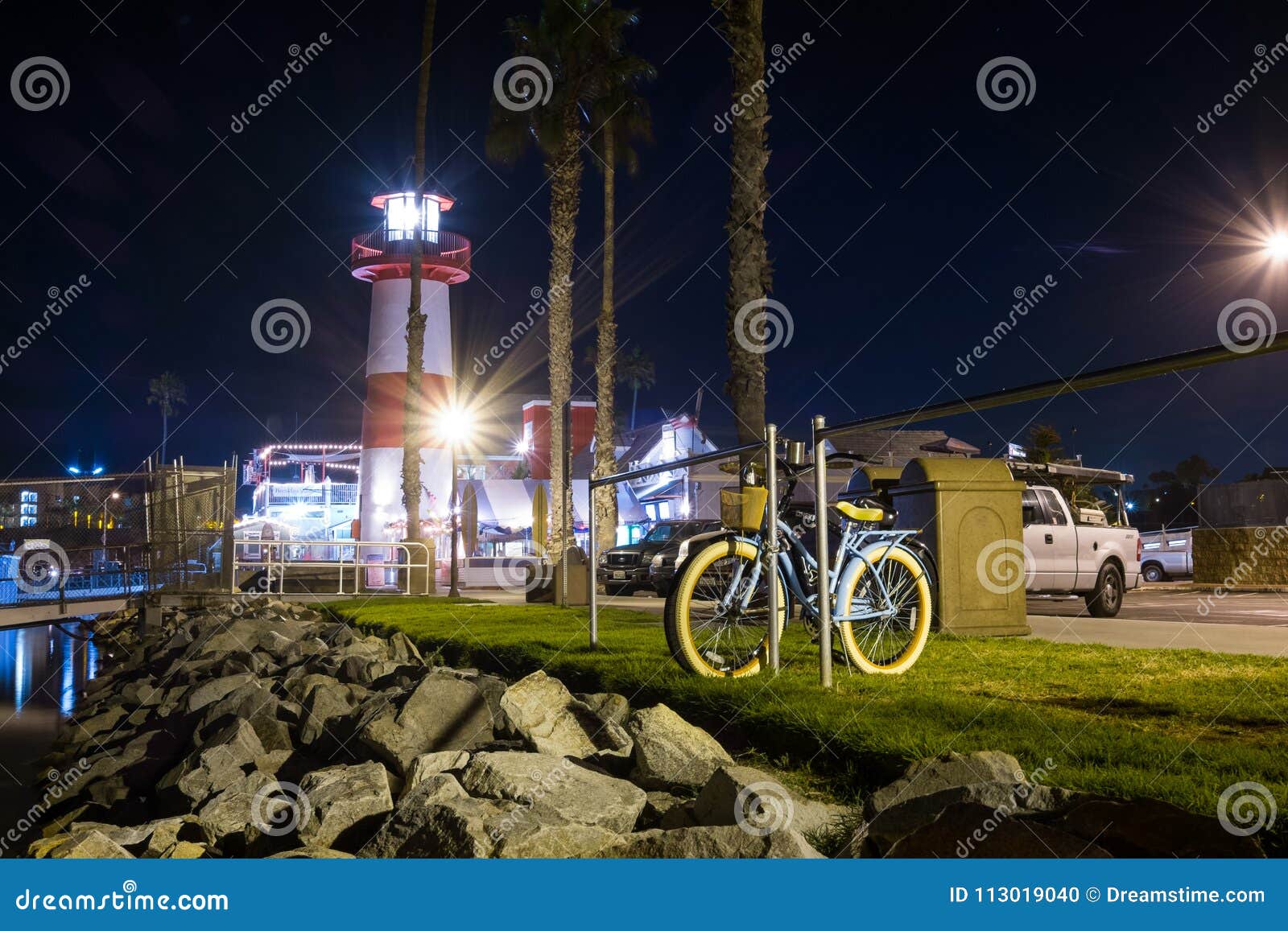 Oceanside Harbor Lighthouse & Bicycle Stock Photo - Image of rock, calm ...