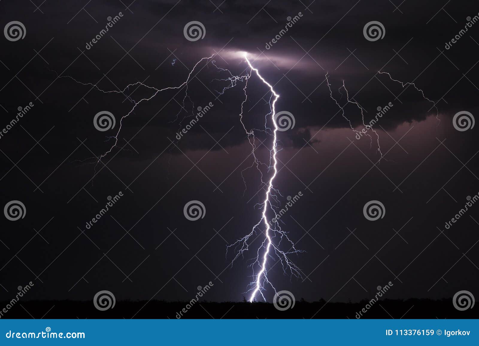 Lightning Strike Over a Field Stock Image - Image of lightning ...