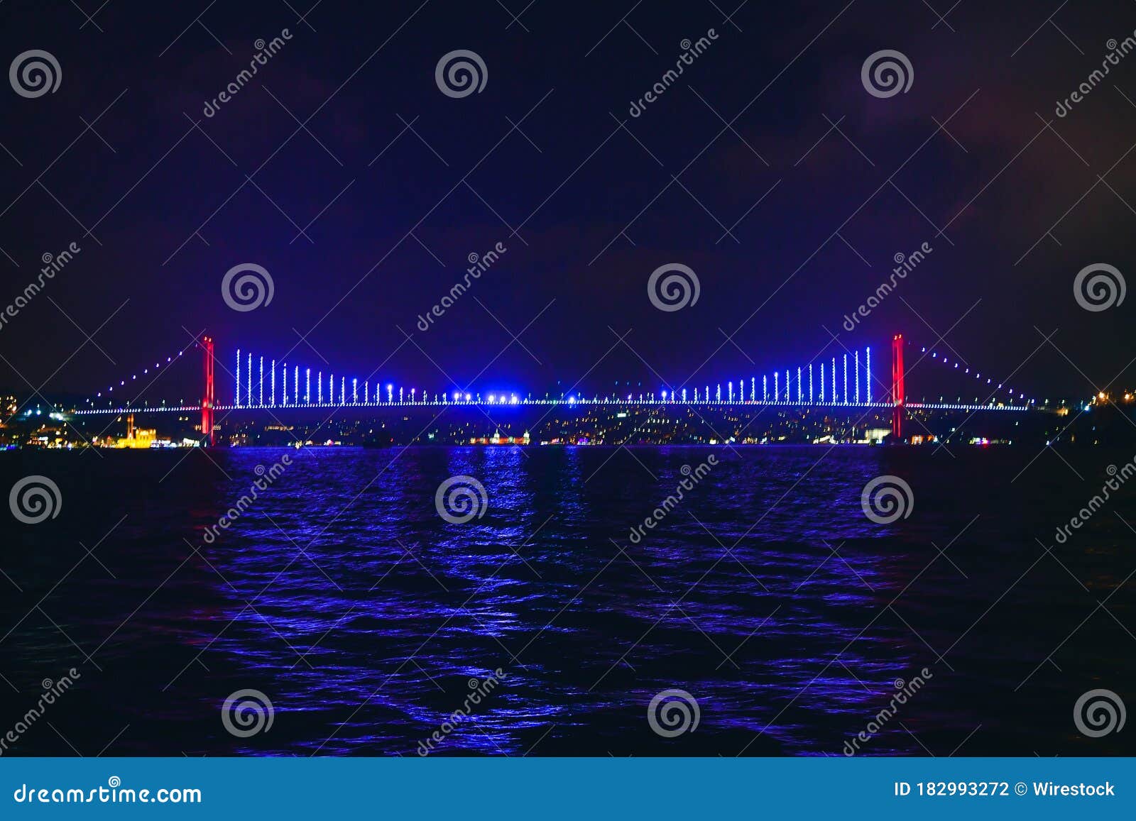 Night View of the Bosphorus Bridge with Buildings in the Background in ...