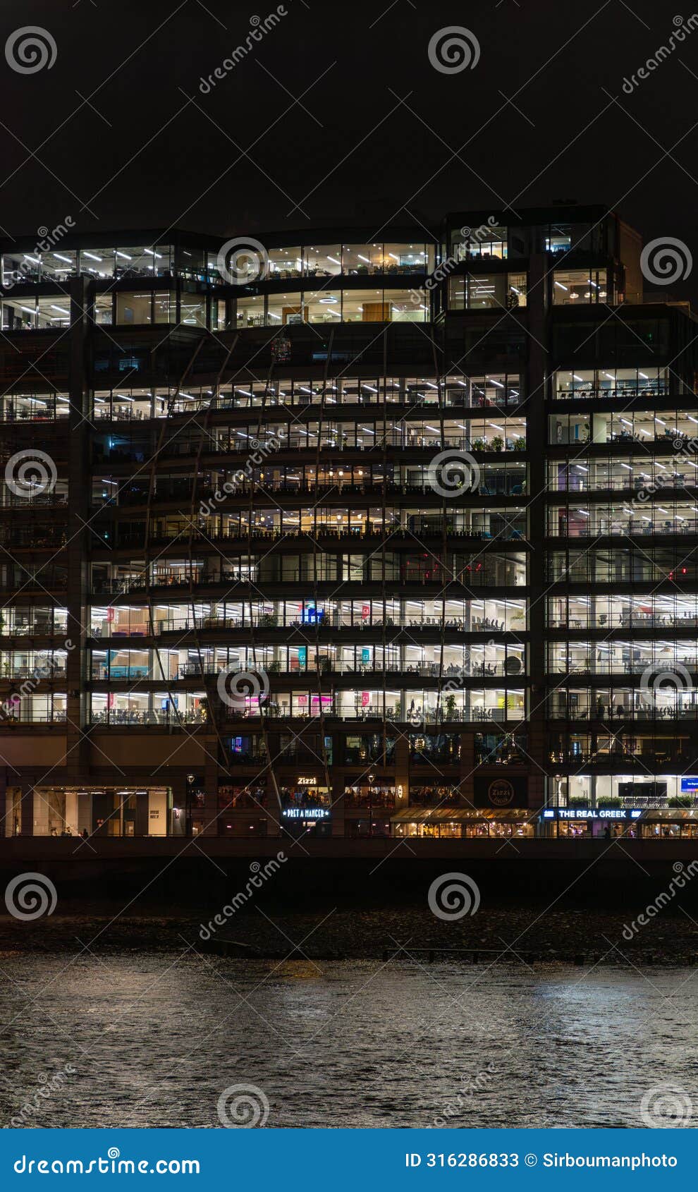 Night View of the Facade of Riverside House and Its Restaurants at ...