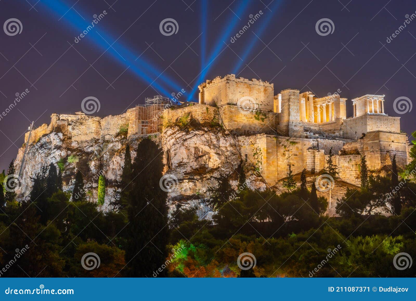 Night View of Illuminated Akropolis with Light Beams Directed into the ...
