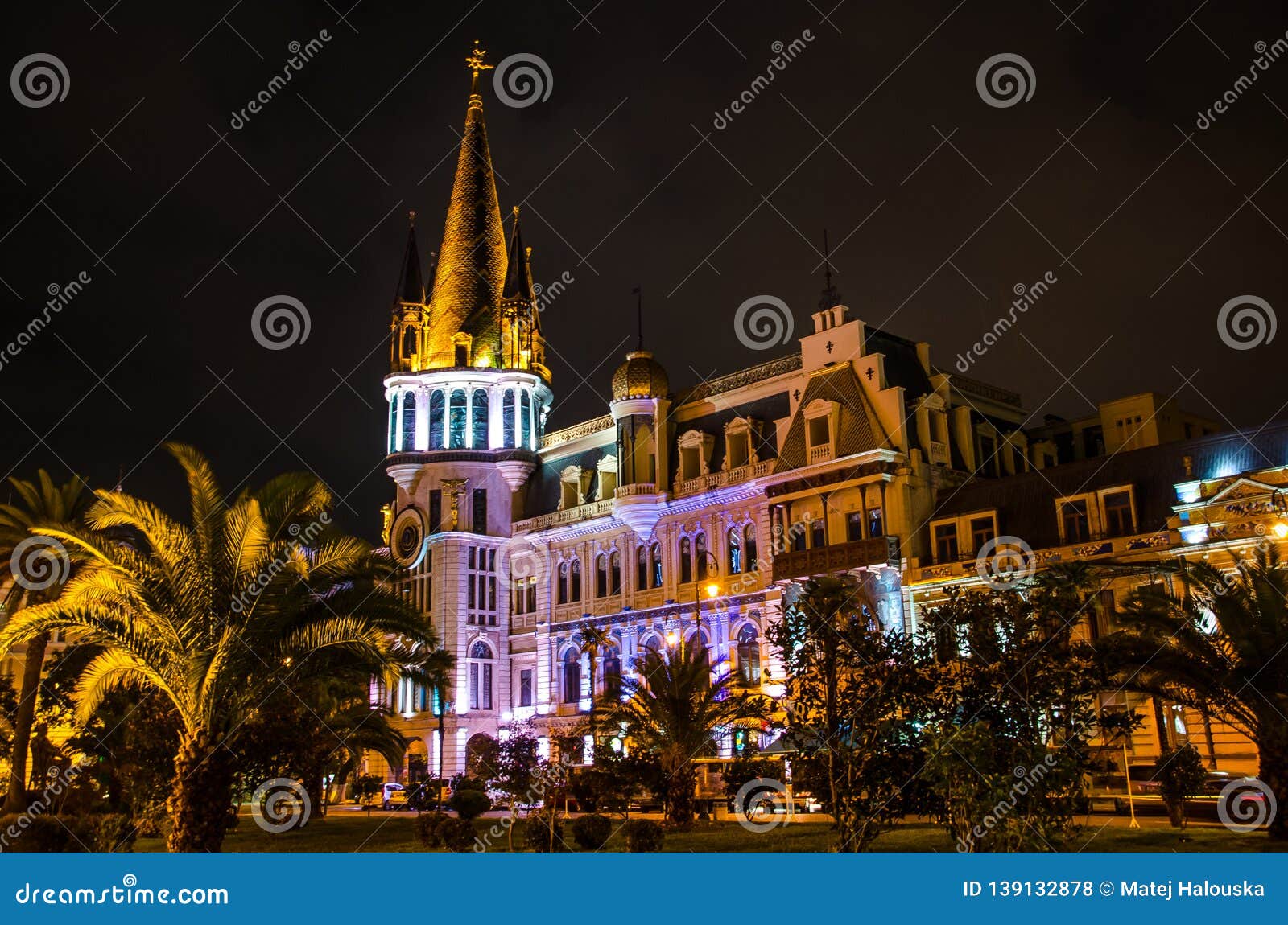 Night View of Illuminated Batumi Astronomical Clock Tower Building with ...