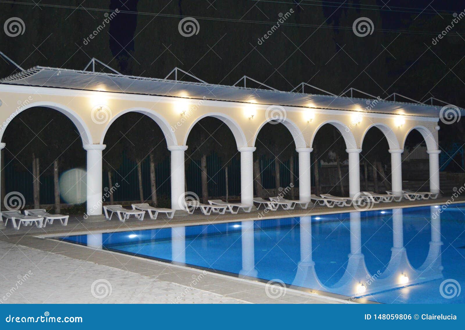 Night View of the Luxurious Pool with Columns and Arches, Reflected in ...