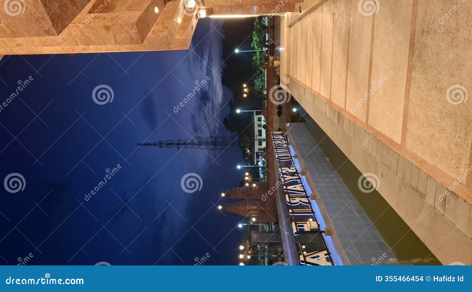 Night View of a Temple Complex with a Pathway and Water Feature Stock ...