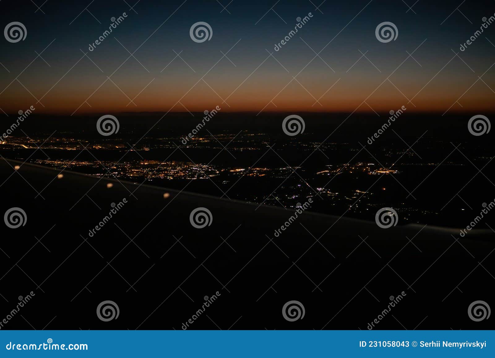 Night View of the Wing of the Plane through the Window. Flight and ...