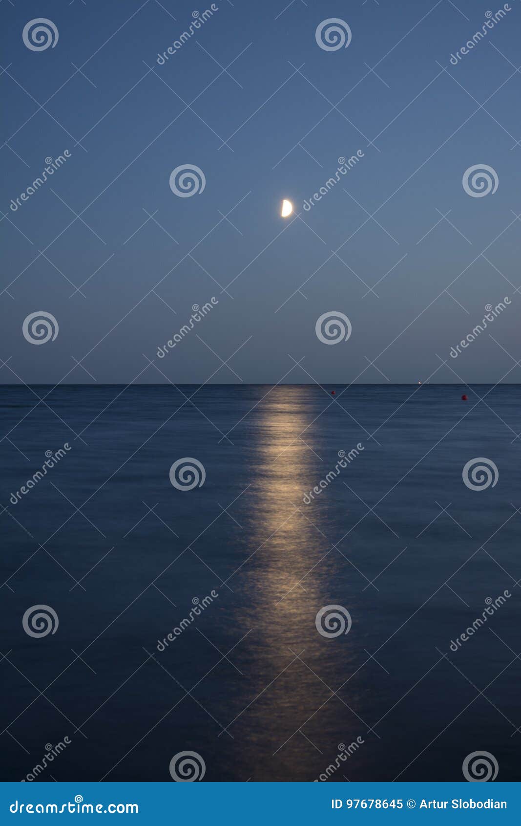 At Night a White Moon Over the Sea with a Reflection Stock Image ...