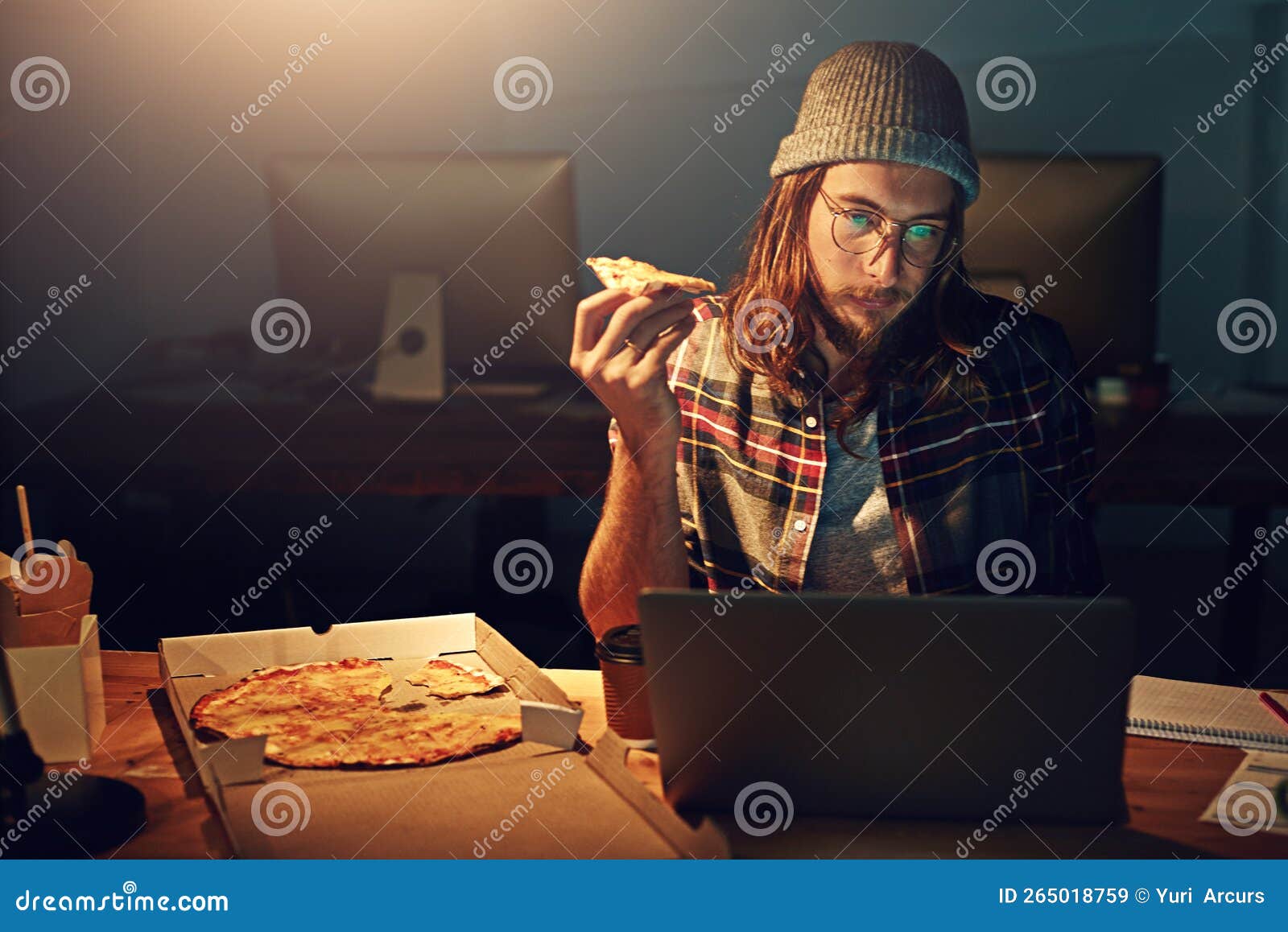 Nightshift is so Laid Back. a Designer Working on His Laptop on a Night ...