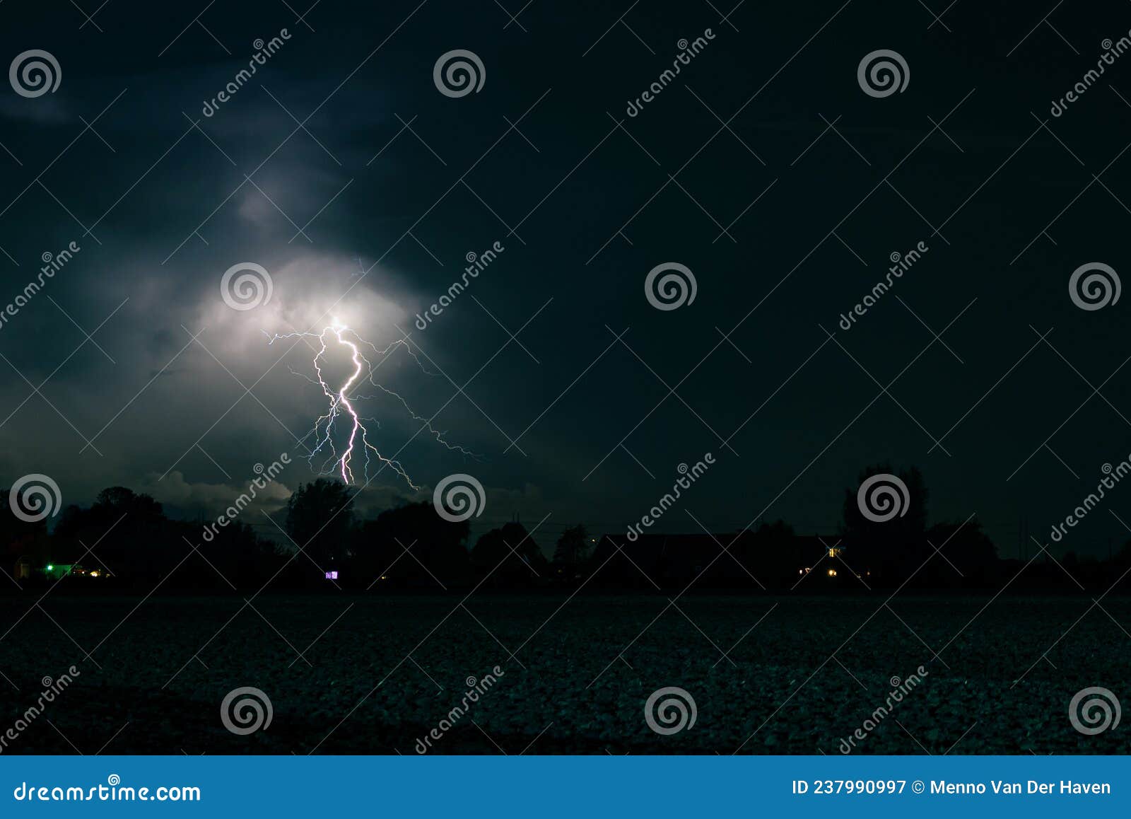 Lightning Strikes Down from a Distant Storm Cloud Stock Image - Image ...