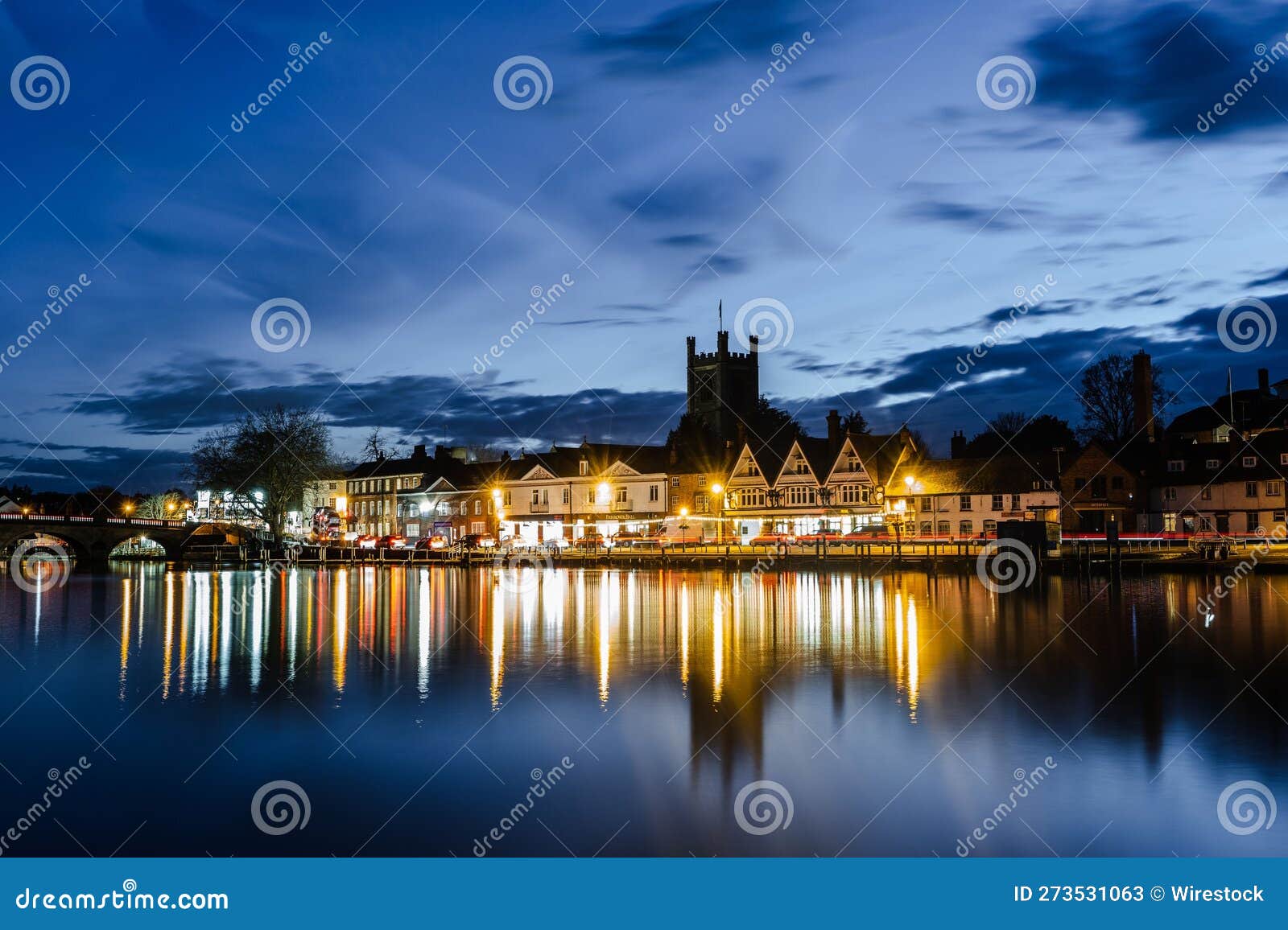 Nighttime View of a Row of Buildings on the Lakeside with Their ...
