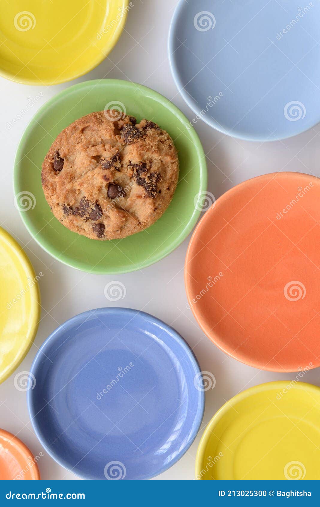 Cookie with Chocolate Chips Surrounded with Empty Plates Stock Photo ...