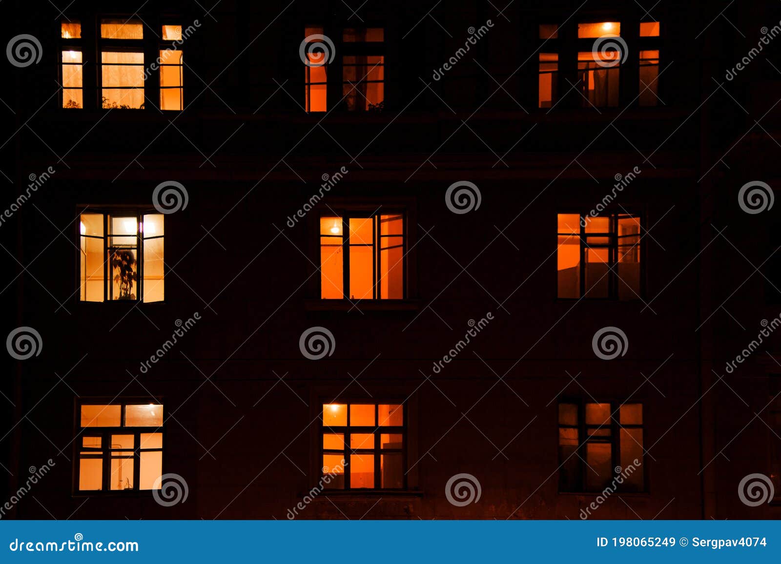 Nine Lighted Windows in the Night Stock Image - Image of facade, brown ...