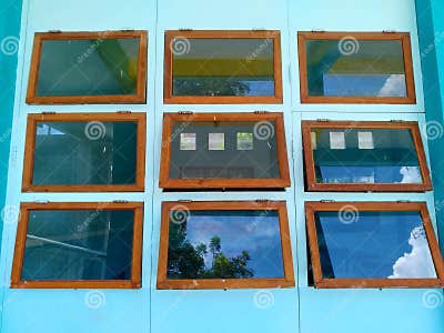 Nine Windows on a Light Blue Wall Stock Image - Image of windows, nine ...