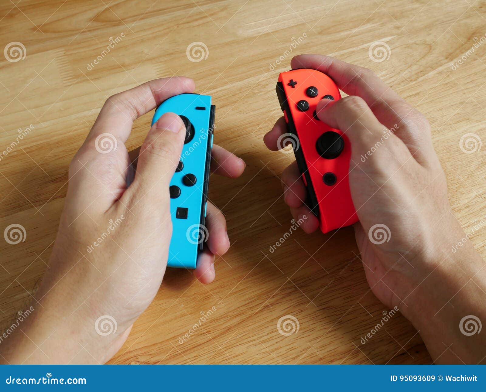 Nintendo Switch Controllers Held in Hands. Editorial Stock Image ...