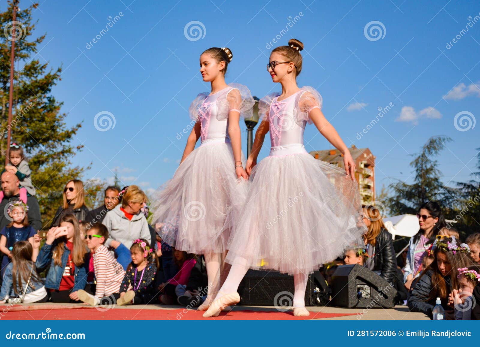 Harmonic Elegance: Teenage Ballerinas Illuminate the Open-Air Stage ...