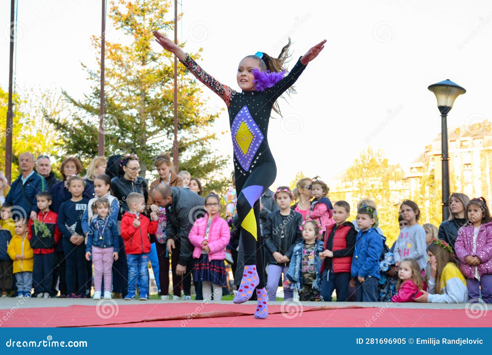 Energetic Dance Performance in Colorful Attire on Open Stage for World ...