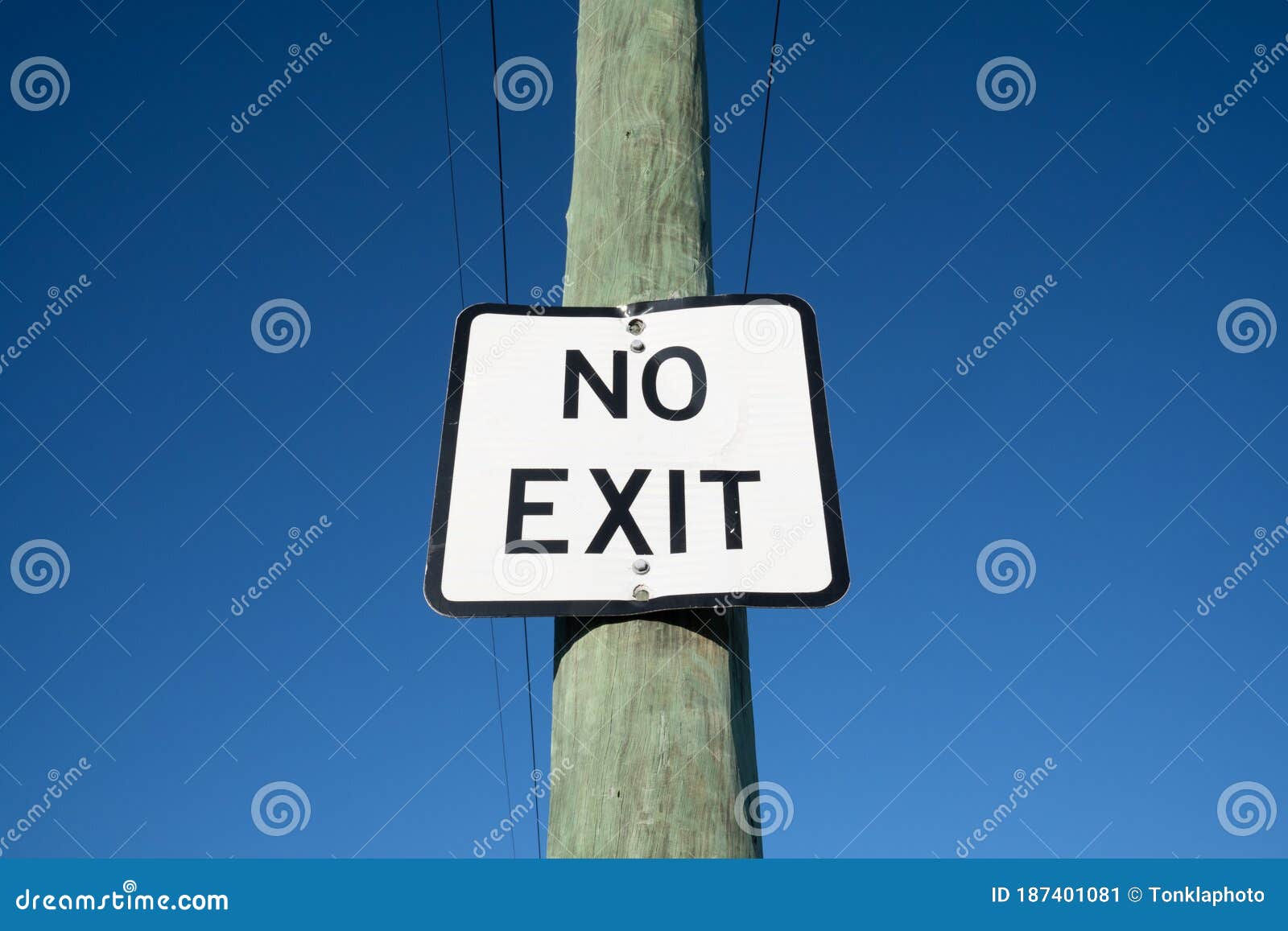 No Exit Sign Hang on Wooden Electric Pole with Blue Sky Stock Image ...