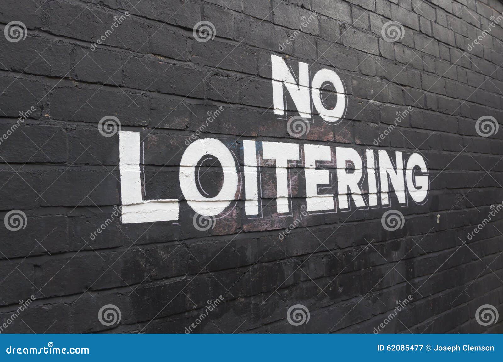 No Loitering Sign On Black And White Granite Or Marble Wall Stock Photo ...