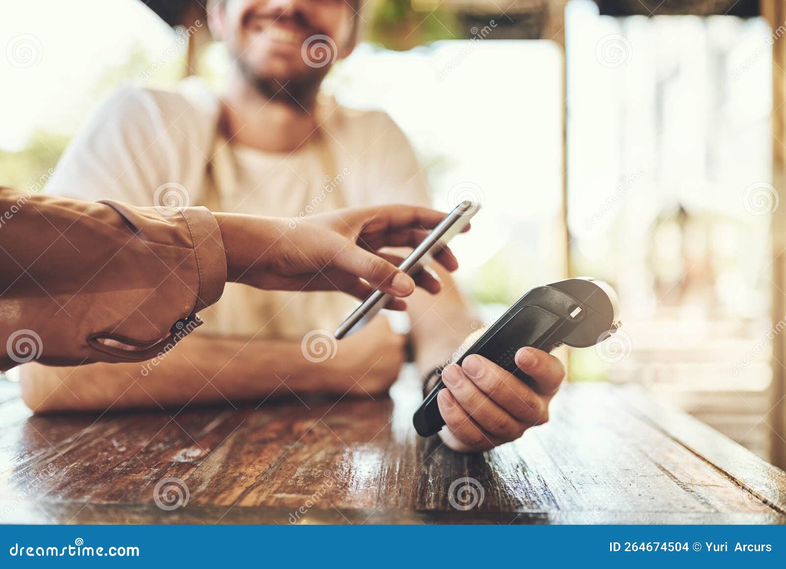 No Need for Wallets these Days. a Customer Making a Wireless Payment in ...