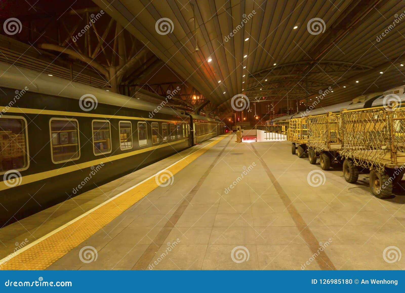 The Railway Platform and the Train at Night. Stock Photo - Image of ...