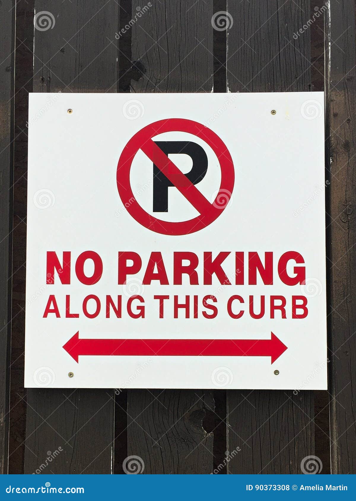 A Curb Sign Points To A Stip Mall Across Road Royalty-Free Stock ...