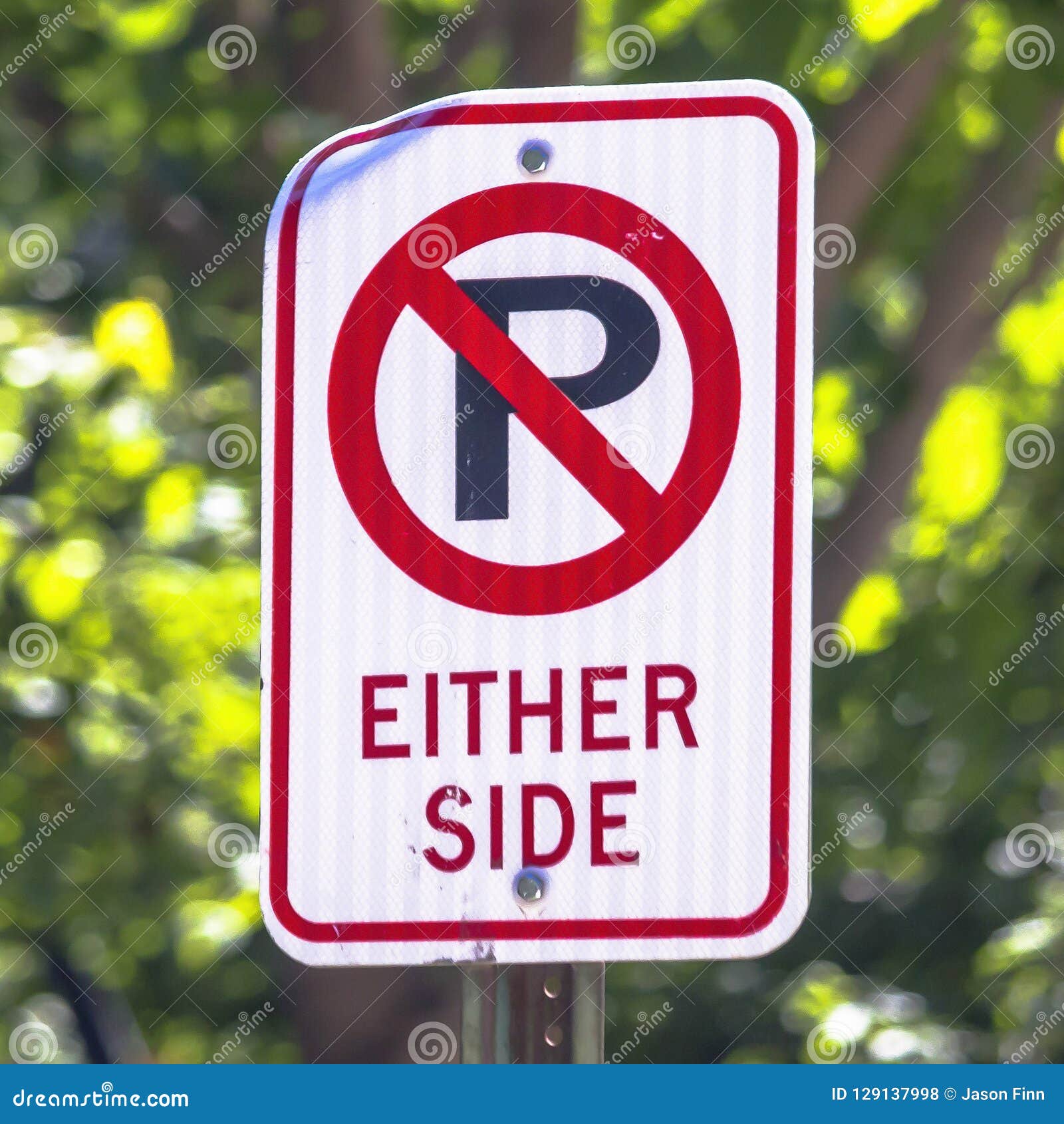 No Parking on Either Side Sign Post Stock Photo - Image of message ...