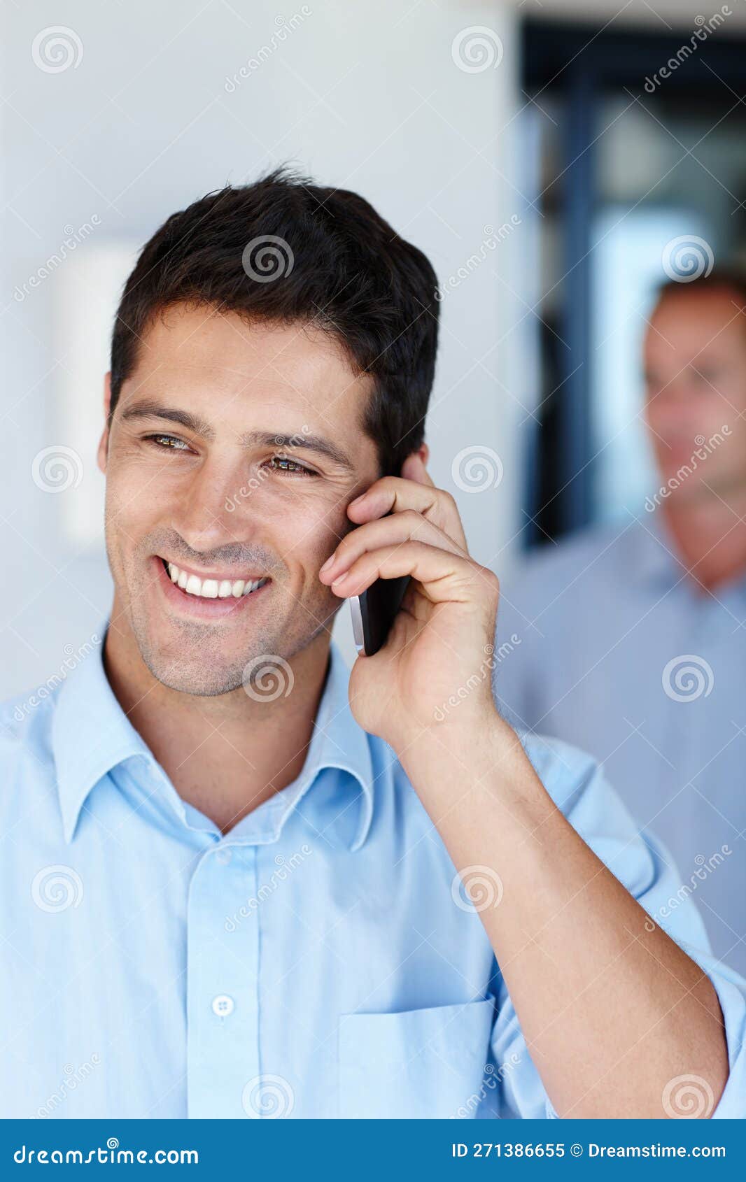 No Strings Attached. a Young Man Taking a Call in the Office. Stock ...