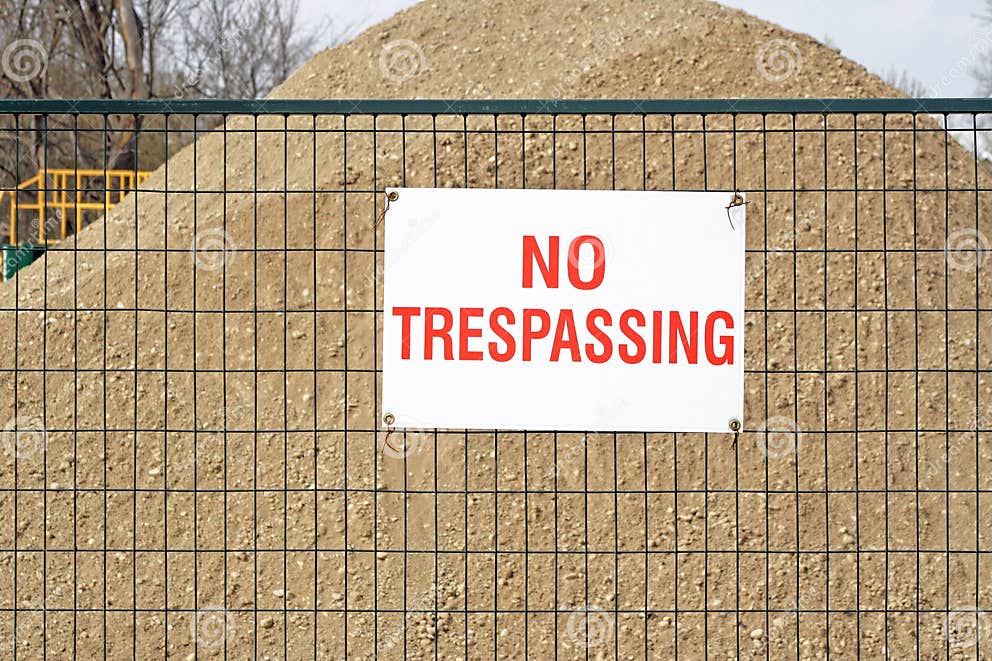 NO TRESPASSING Sign at Construction Site Stock Image - Image of pile ...