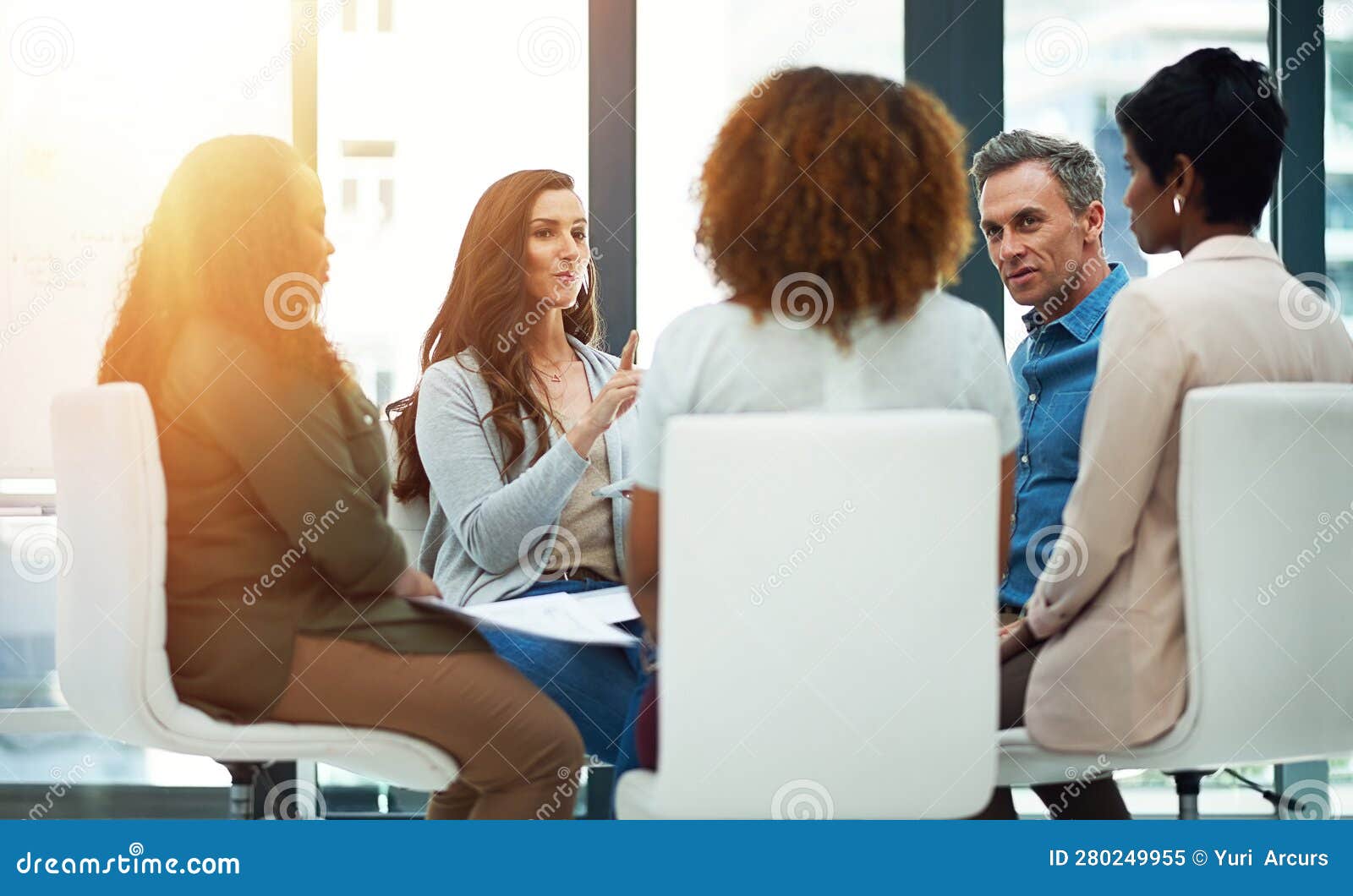 No Update Goes Unshared. a Team of Colleagues Having a Meeting in a ...