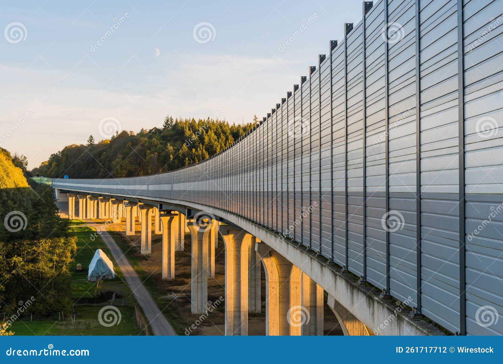 Noise Barrier on A45 Bridge Illuminated by Sun Rays, Surrounded by ...