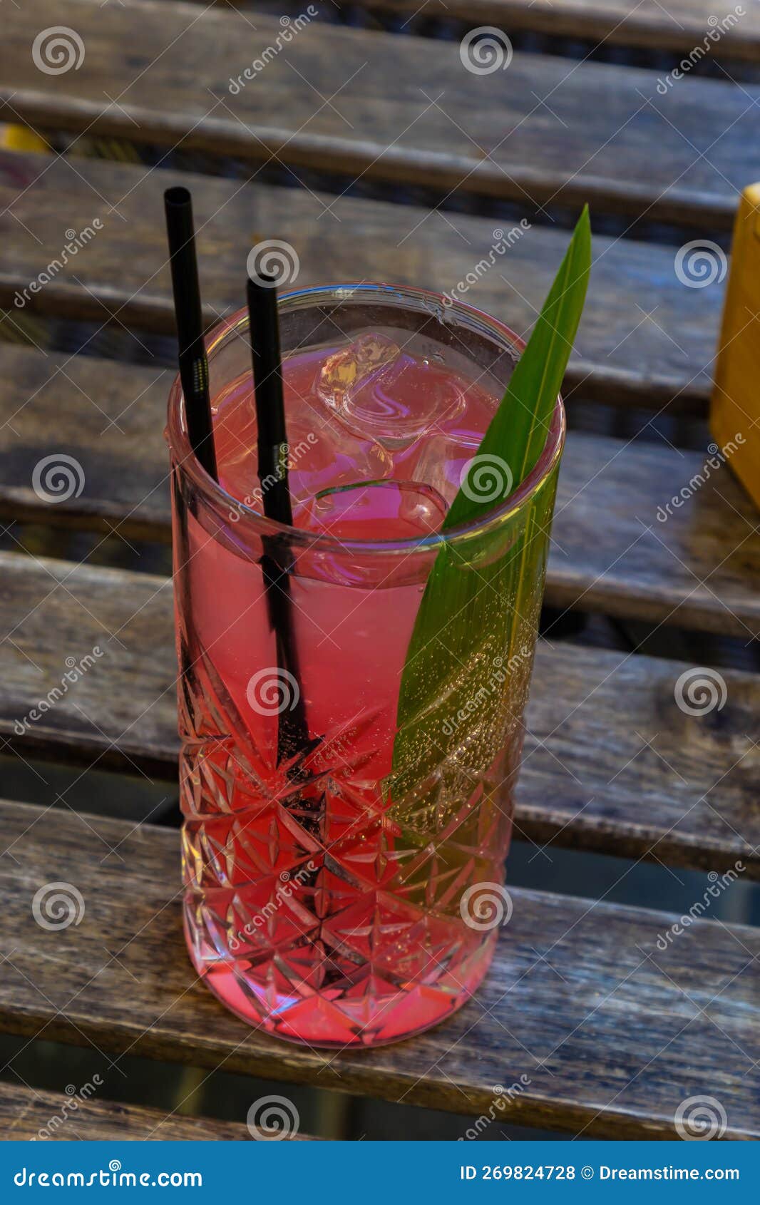 Non Alcoholic Cocktail On A Wooden Table Of A Street Cafe On A Summer