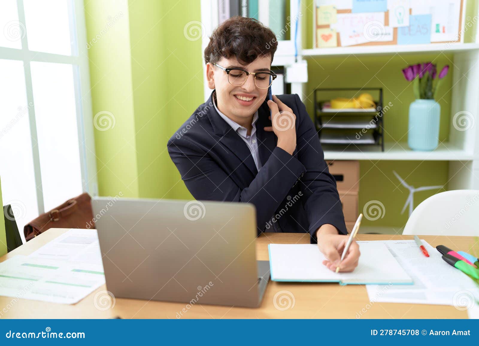 Non Binary Man Business Worker Talking on Smartphone Writing on ...