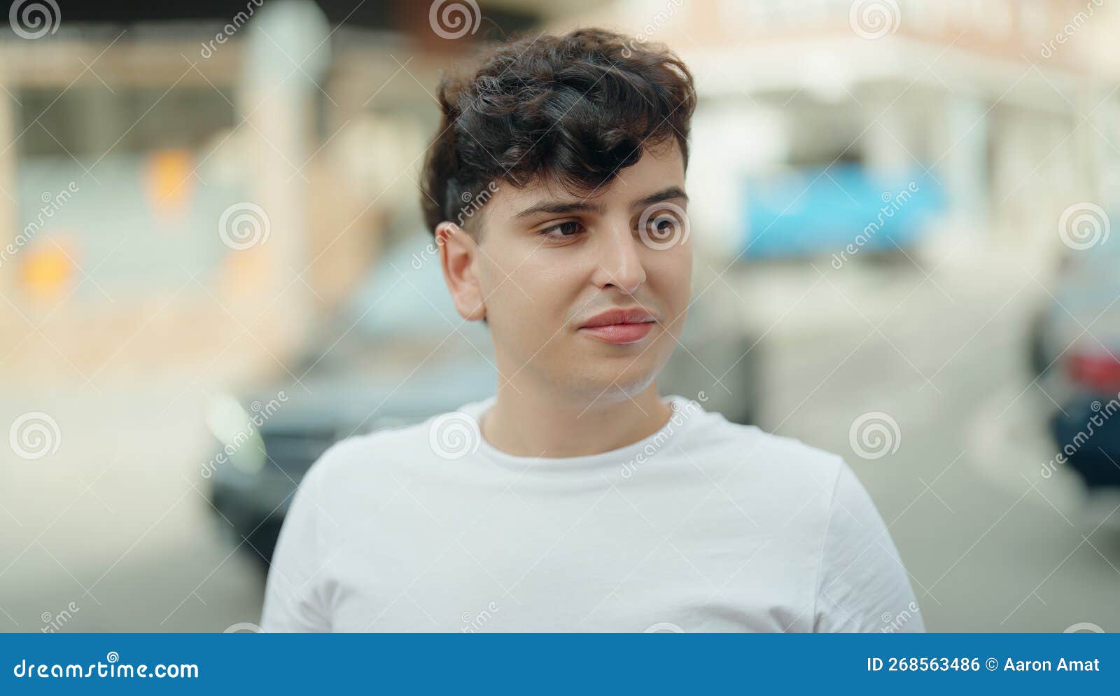 Non Binary Man Looking To the Side with Serious Expression at Street ...