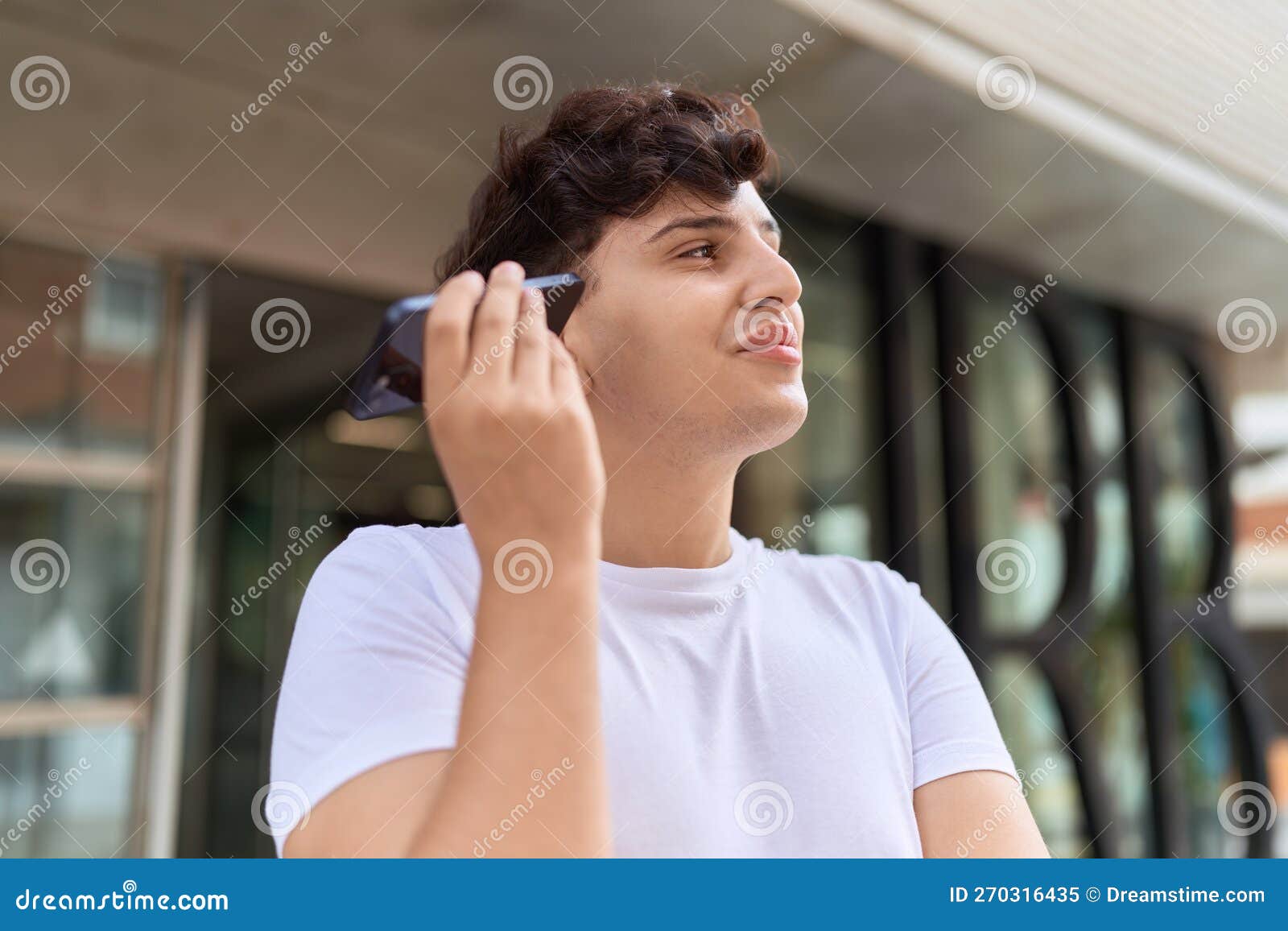 Non Binary Man Smiling Confident Listening Audio Message by the ...