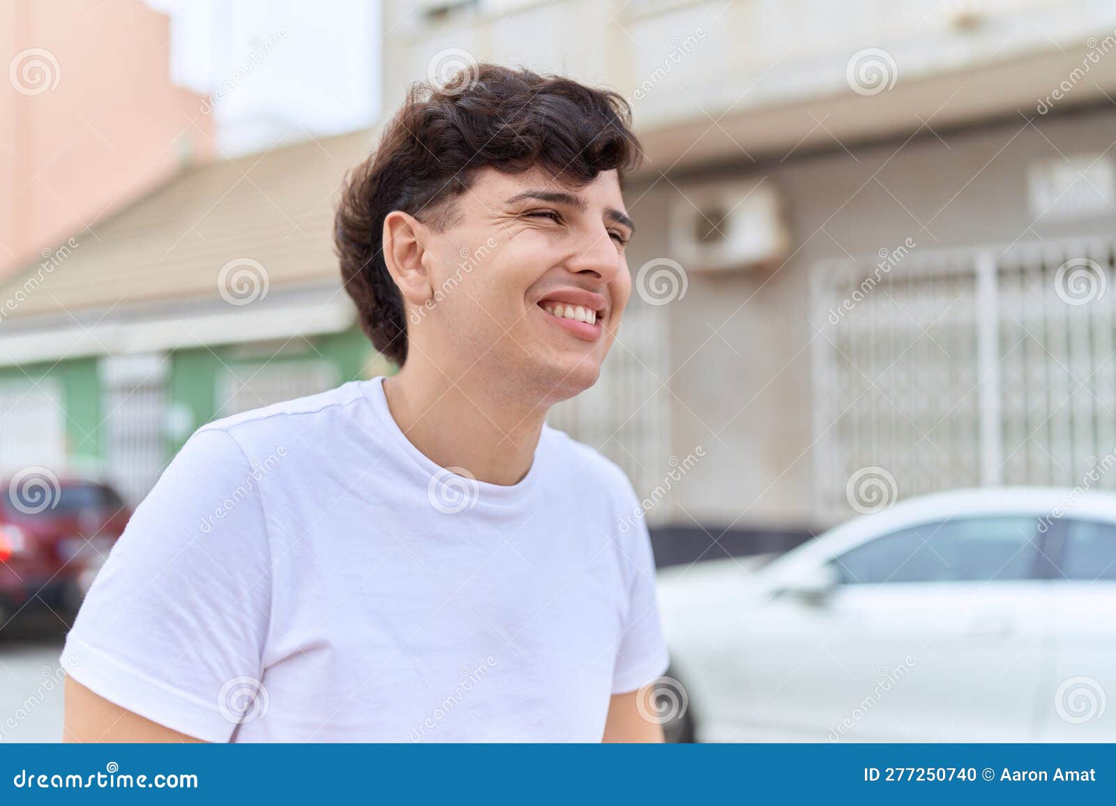Non Binary Man Smiling Confident Looking To the Side at Street Stock ...