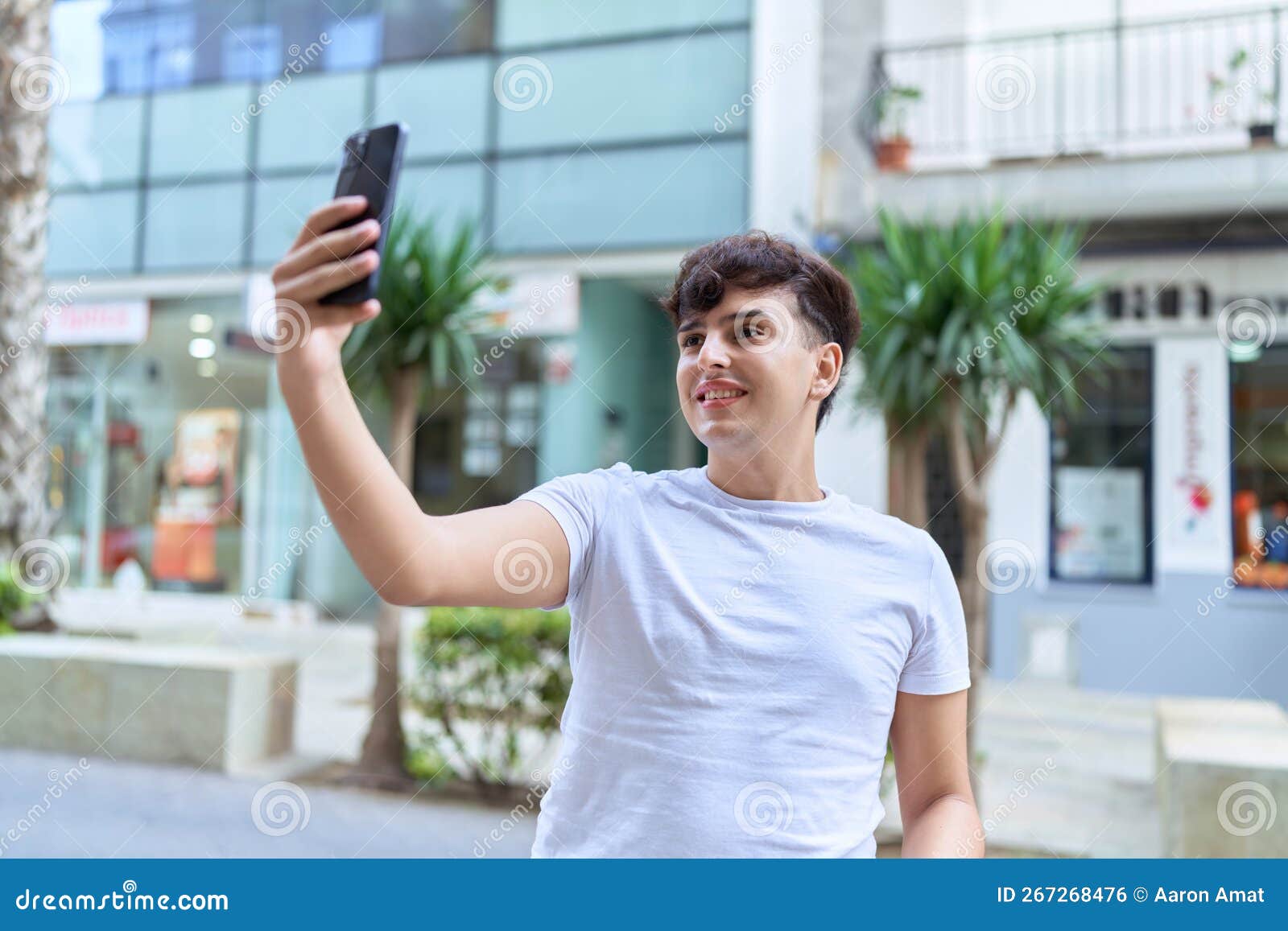 Non Binary Man Smiling Confident Making Selfie by the Smartphone at ...