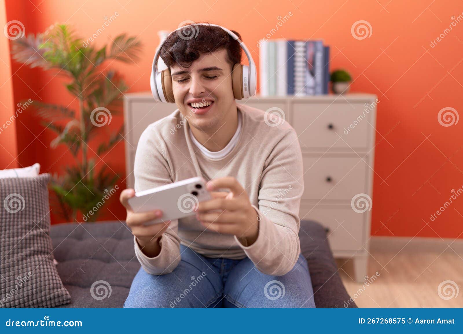 Non Binary Man Smiling Confident Playing Video Game at Home Stock Image ...