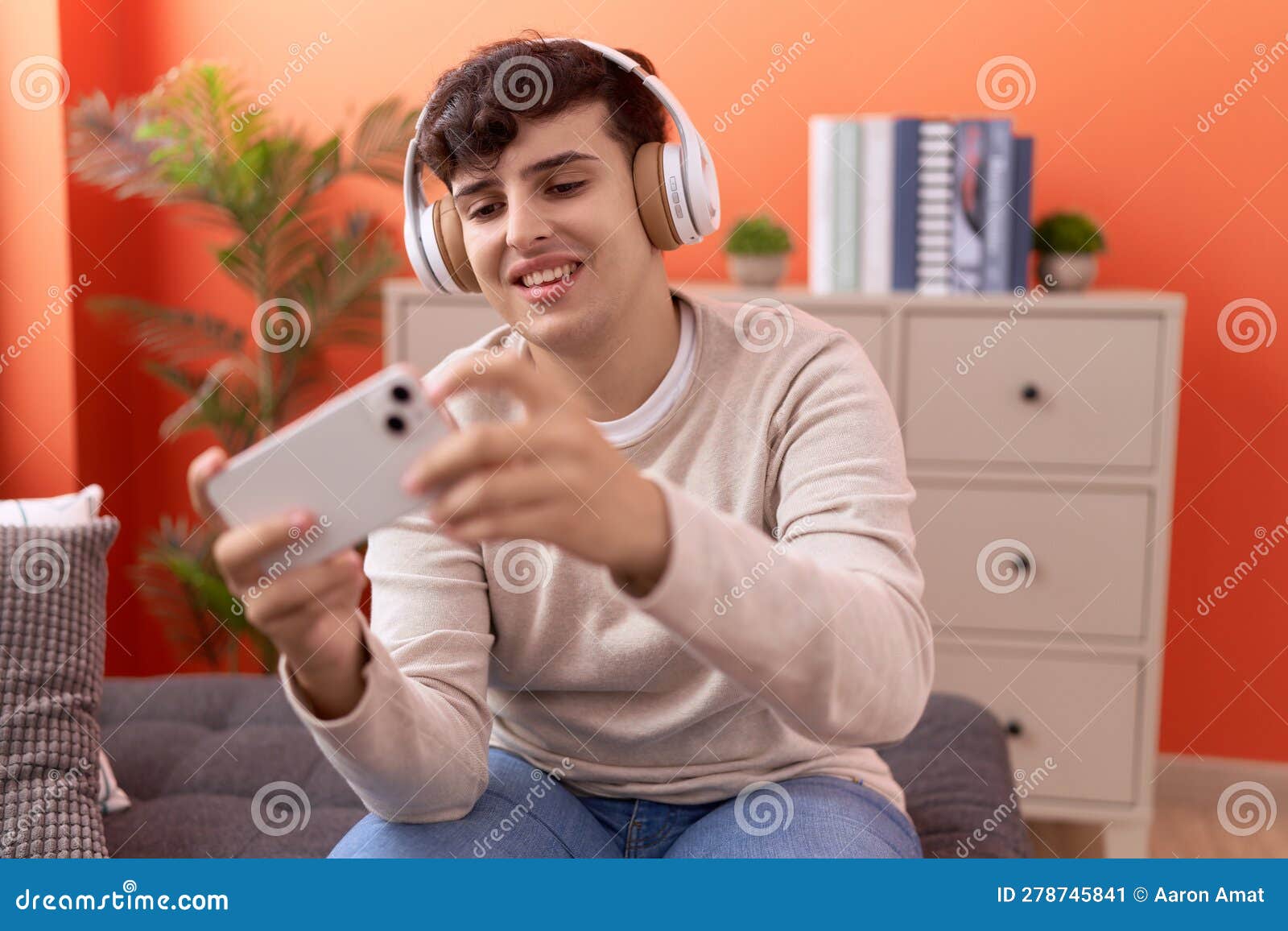Non Binary Man Smiling Confident Playing Video Game at Home Stock Image ...