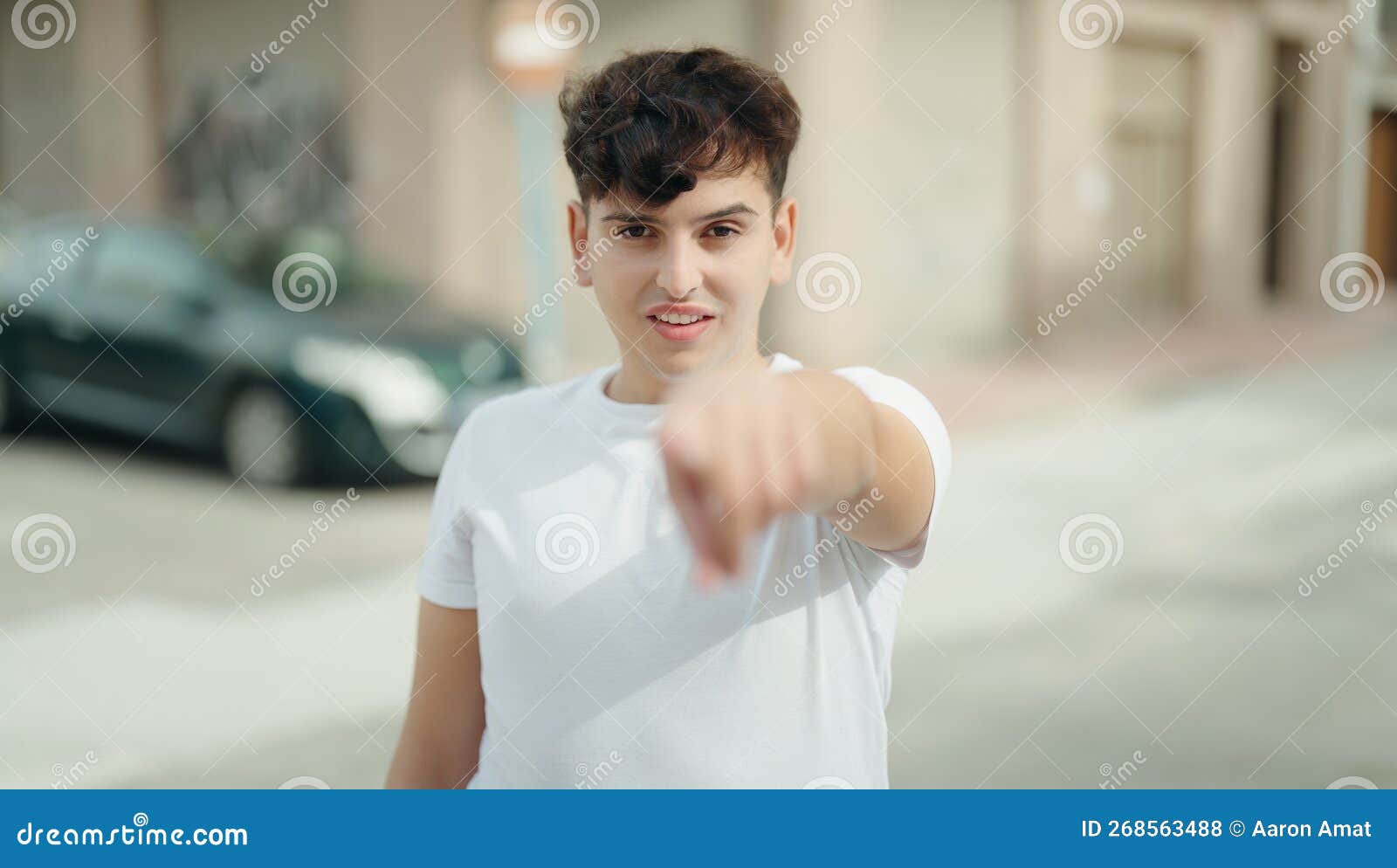 Non Binary Man Smiling Confident Pointing with Finger at Street Stock ...