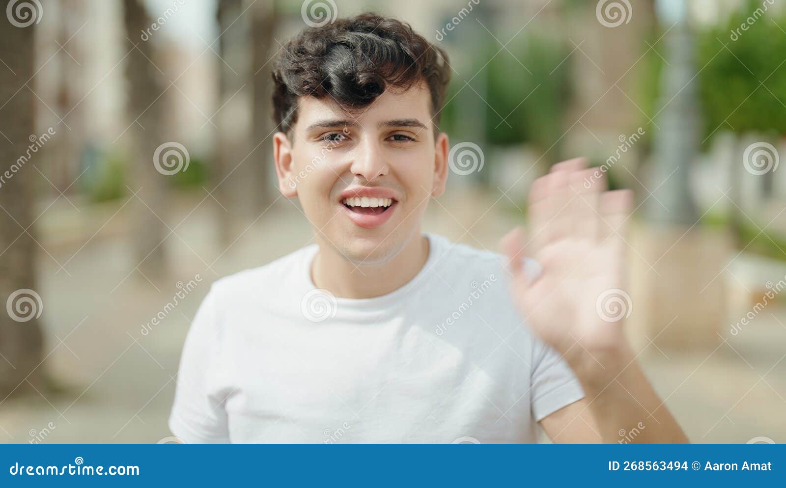Non Binary Man Smiling Confident Saying Hello with Hand at Park Stock ...