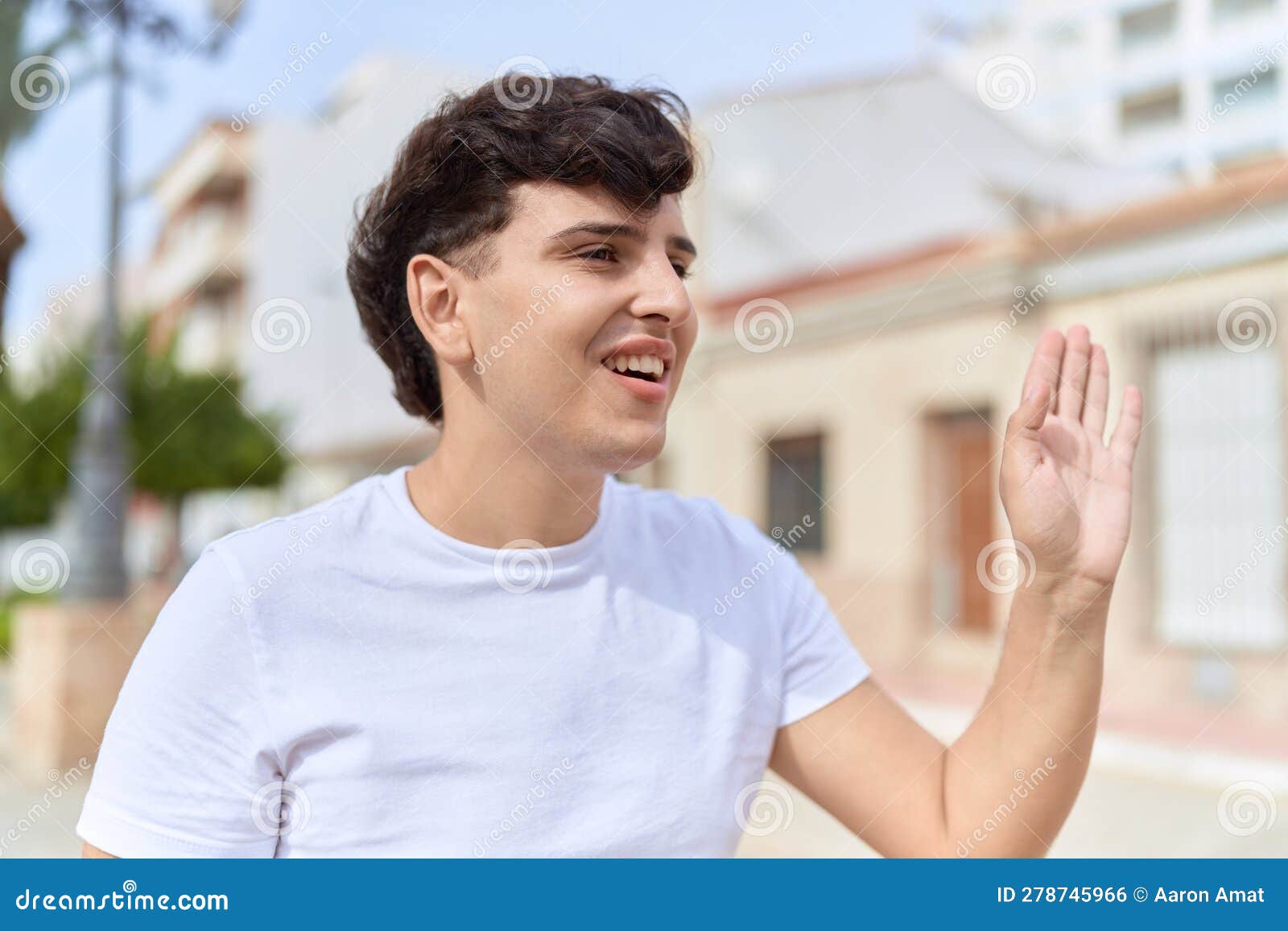 Non Binary Man Smiling Confident Saying Hello with Hand at Park Stock ...